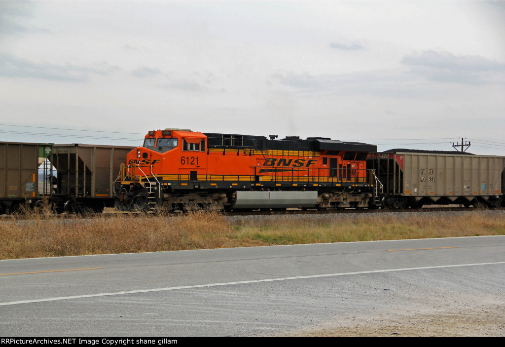 BNSF 6121 works dpu on a loaded coal train.